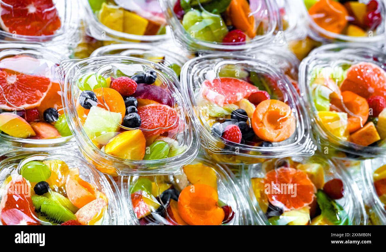 Plastic boxes with pre-packaged fruit salads, put up for sale in a ...