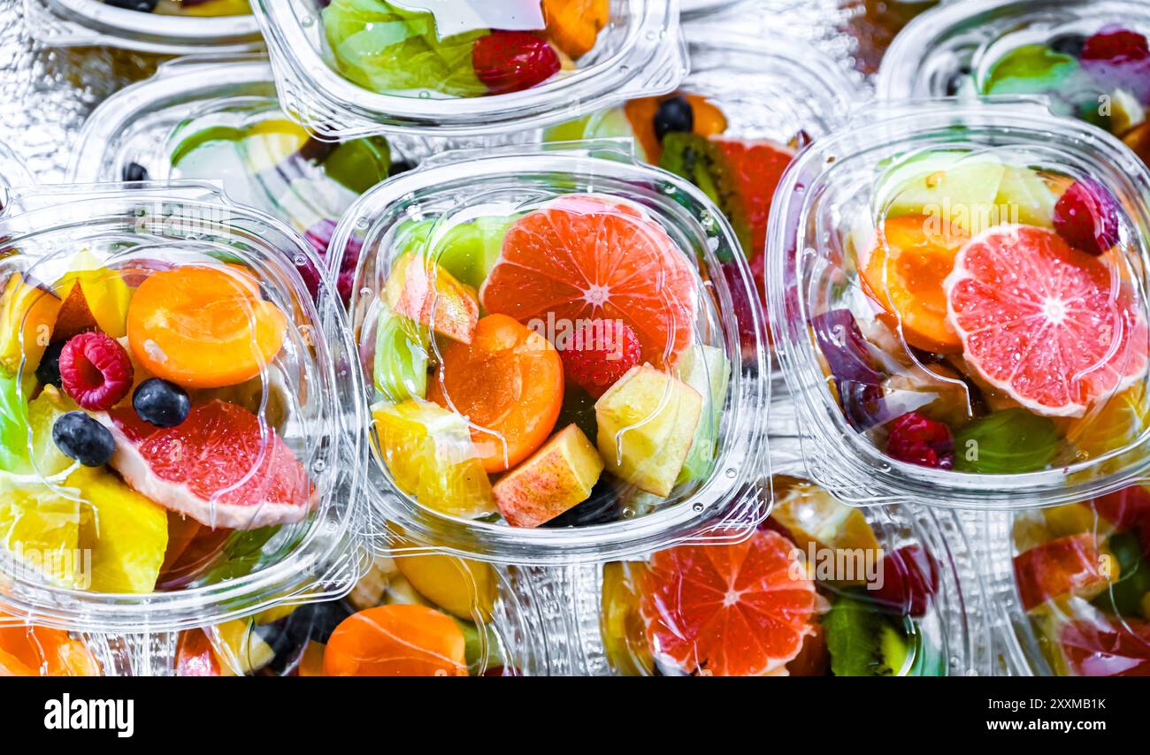 Plastic boxes with pre-packaged fruit salads, put up for sale in a ...