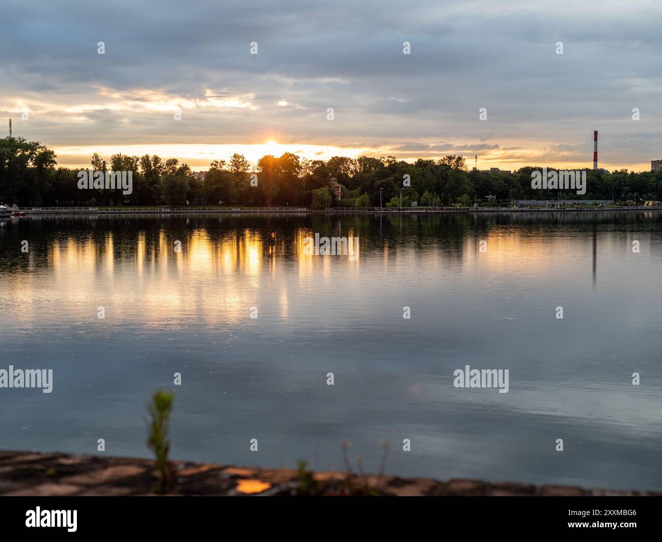 calm surface of water in pond in Kaliningrad city, Russia at summer ...