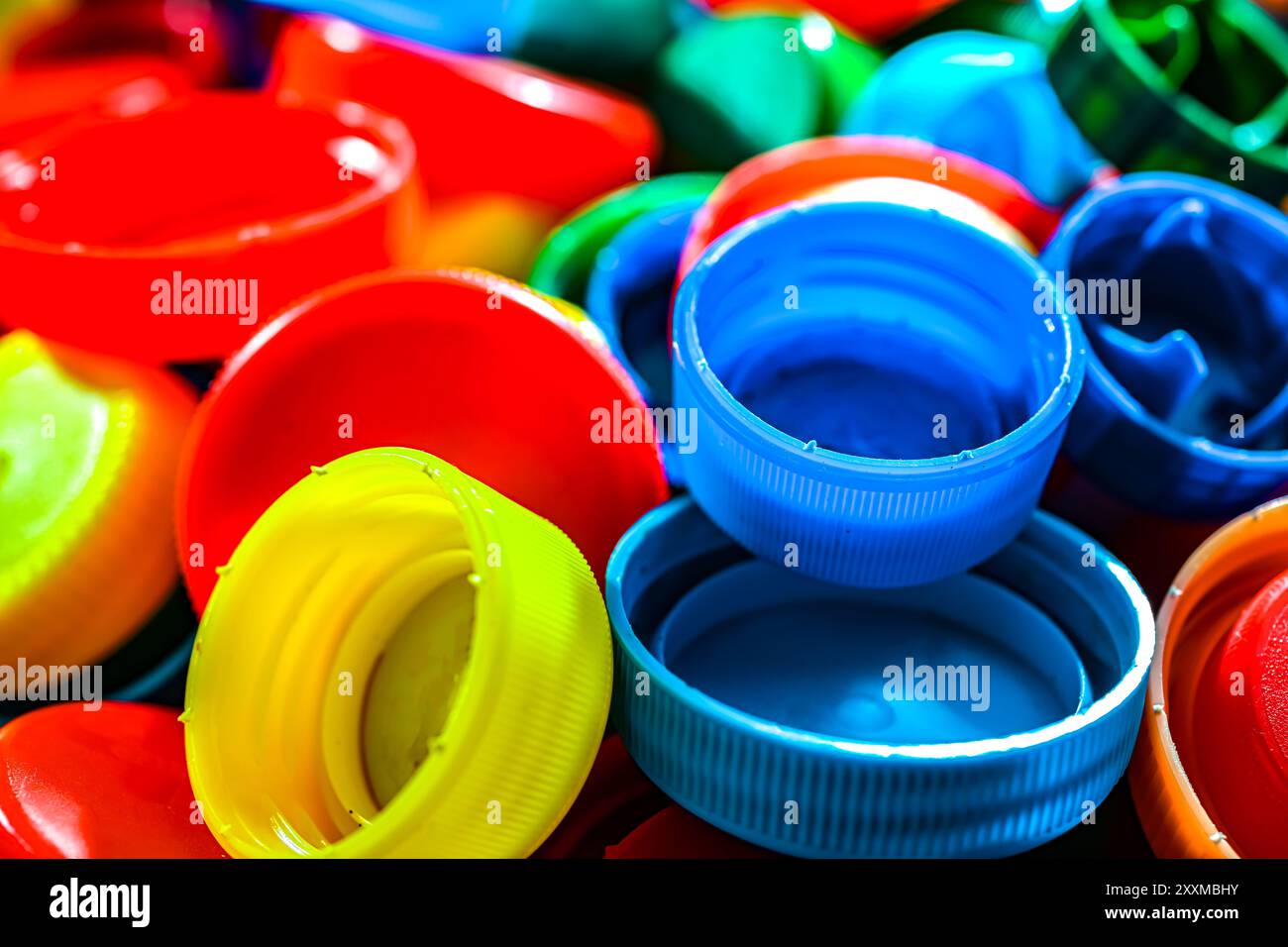 Different sorts of colorful plastic bottle caps. Recycling Stock Photo ...