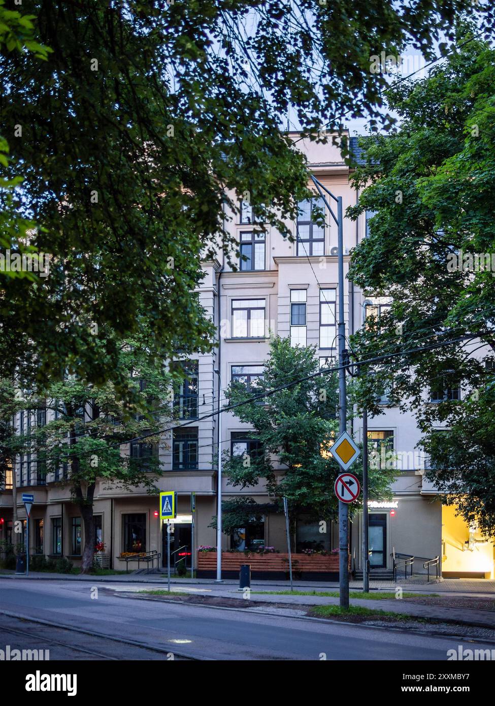 apartment building on street in Kaliningrad city, Russia at summer dusk ...