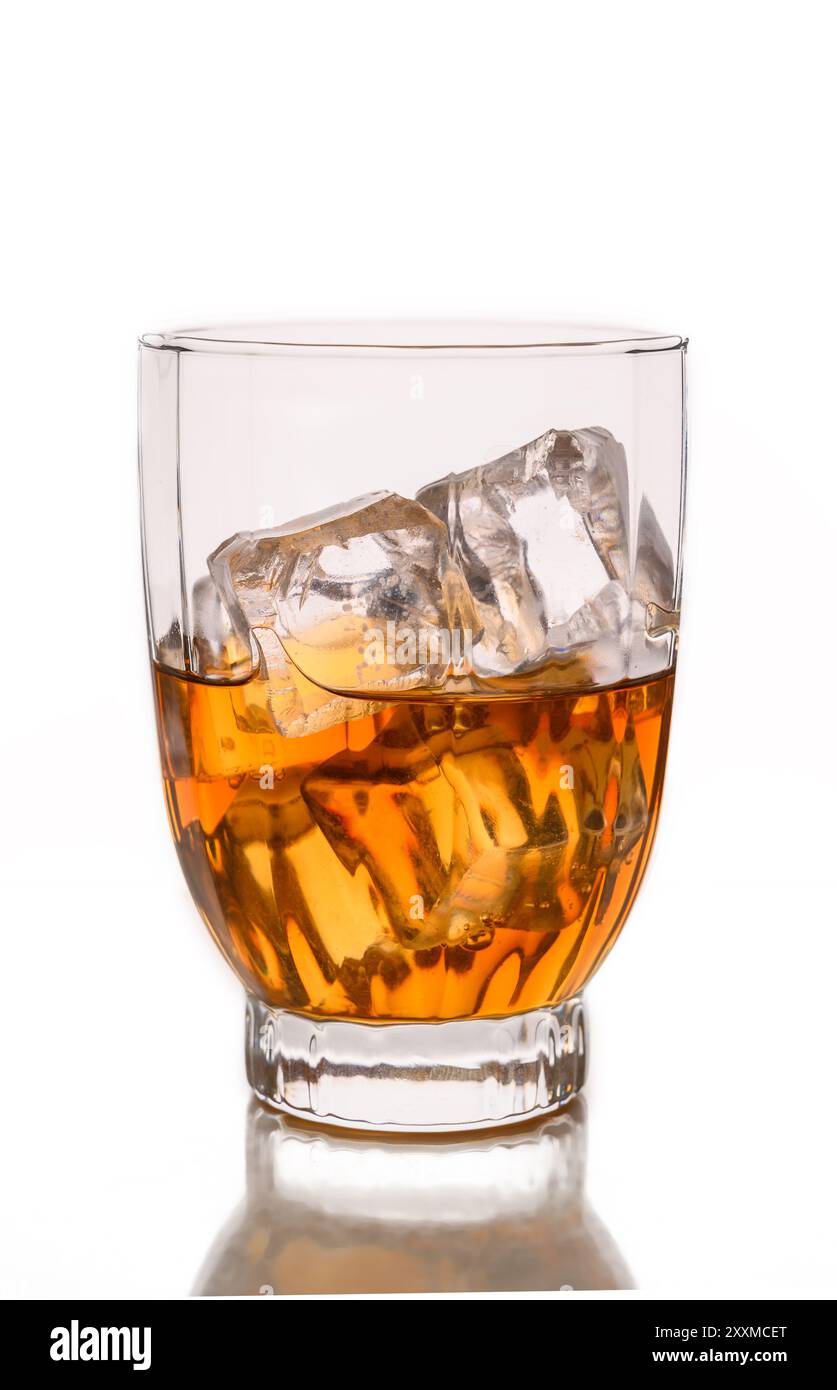 Glass with alcohol and ice cubes Stock Photo - Alamy