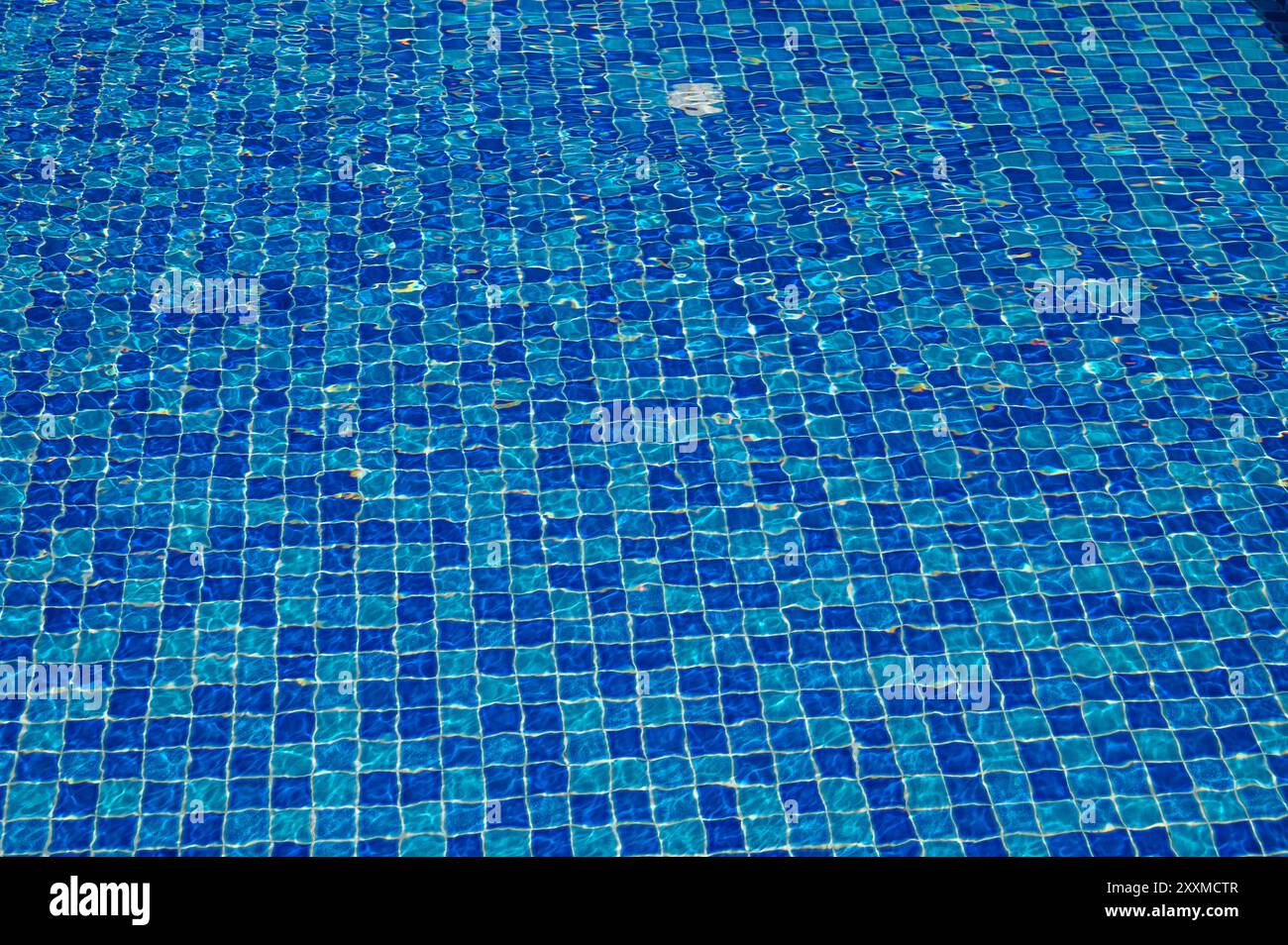 Beautiful sun reflections of water in the pool. Summer. Flight holidays ...