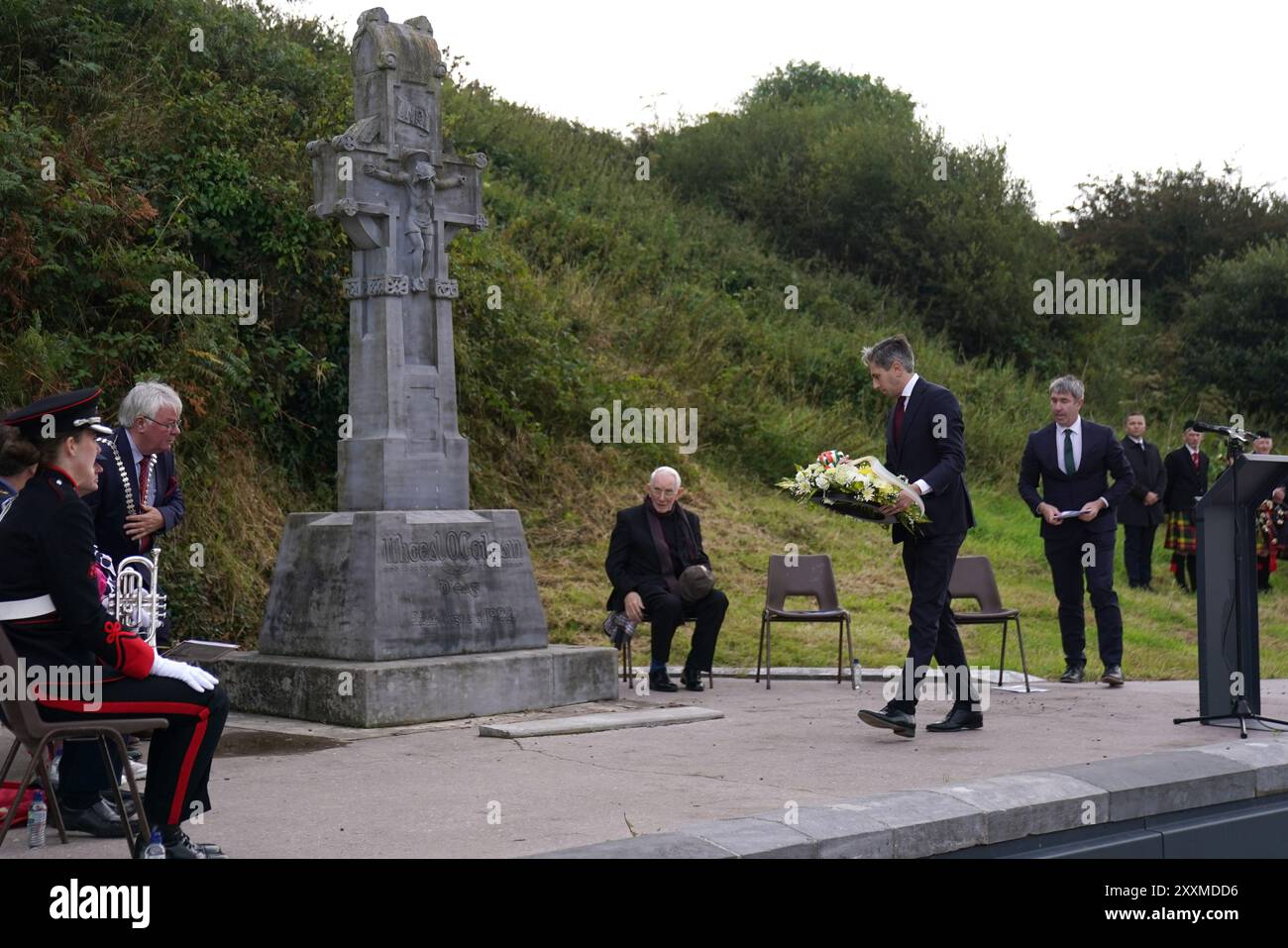 Taoiseach Simon Harris laying a floral tribute during a ceremony at ...