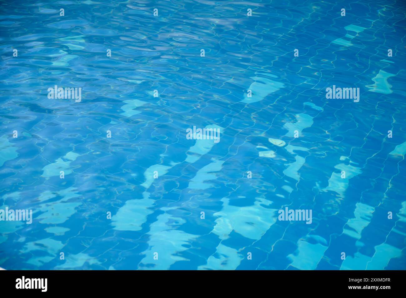 Blue ripped water in swimming pool Stock Photo - Alamy