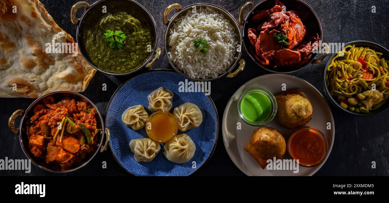 Composition with indian dishes: samosa, pakora, palak paneer, jalfrezi ...