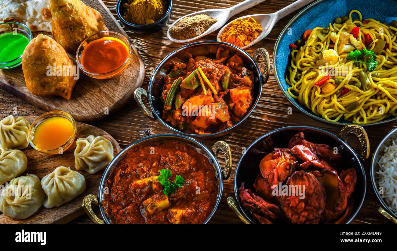 Composition with indian dishes: samosa, pakora, palak paneer, jalfrezi ...