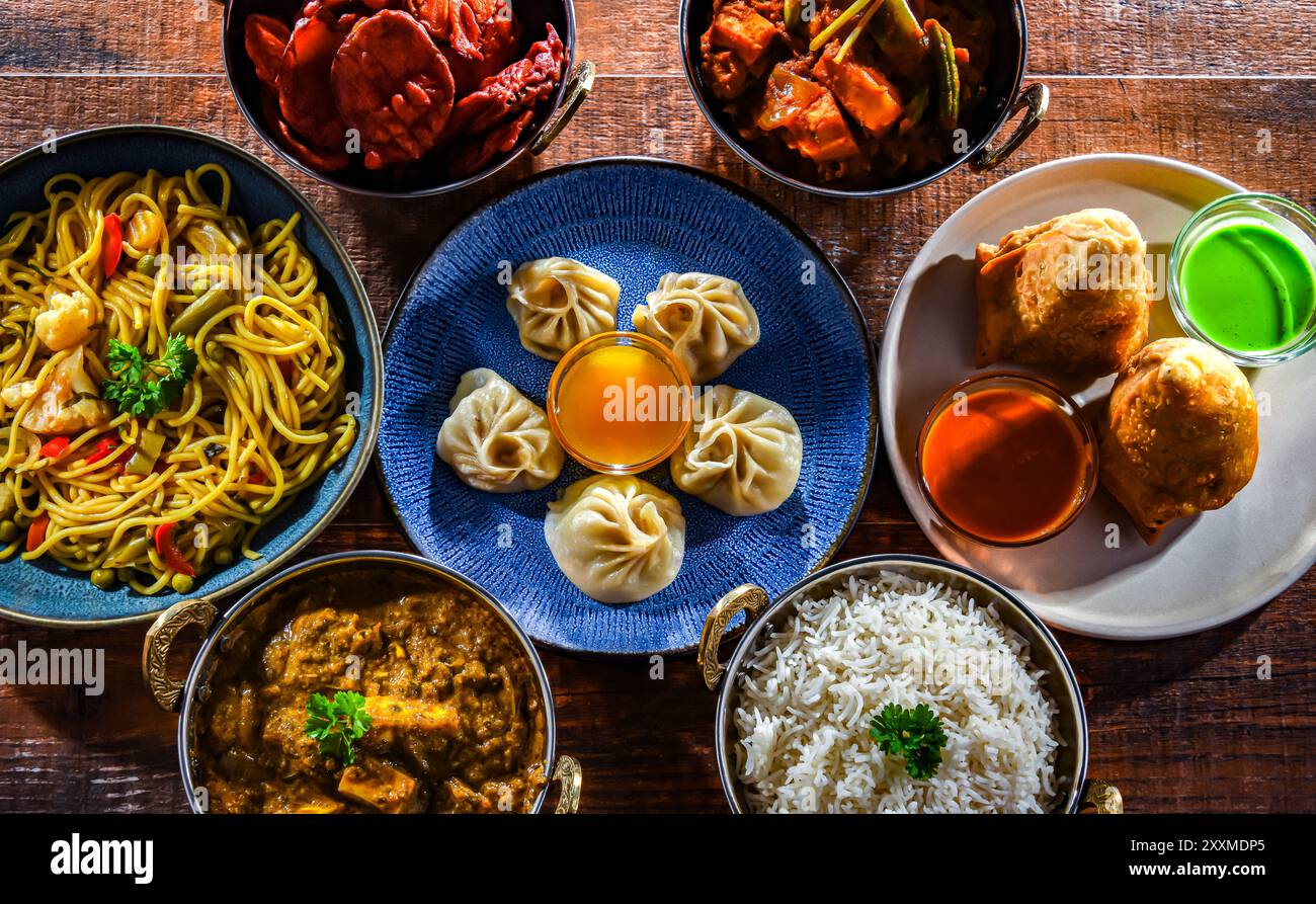 Composition with indian dishes: samosa, pakora, palak paneer, jalfrezi ...