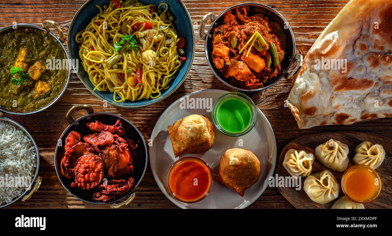 Composition with indian dishes: samosa, pakora, palak paneer, jalfrezi ...