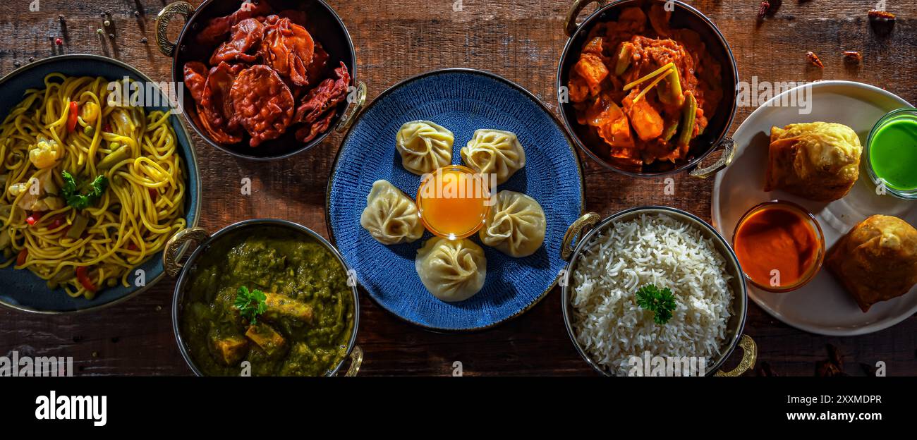 Composition with indian dishes: samosa, pakora, palak paneer, jalfrezi ...