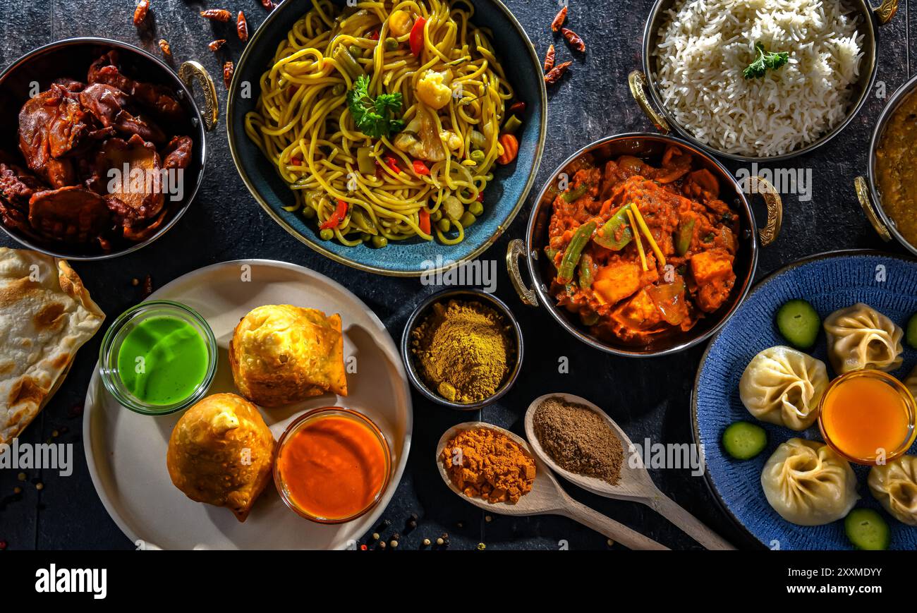 Composition with indian dishes: samosa, pakora, palak paneer, jalfrezi ...