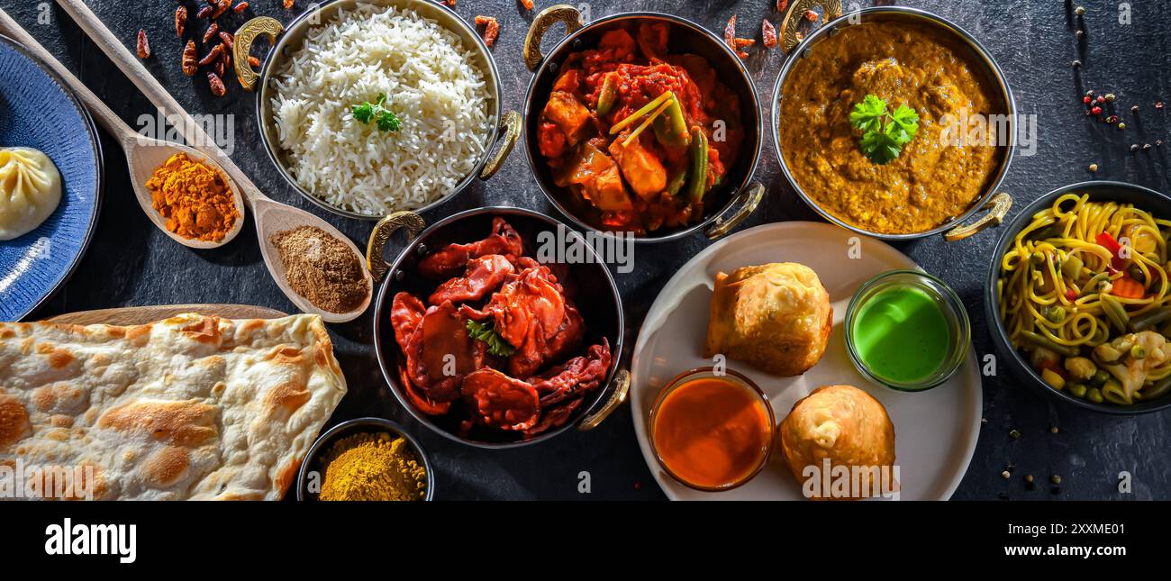 Composition with indian dishes: samosa, pakora, palak paneer, jalfrezi ...