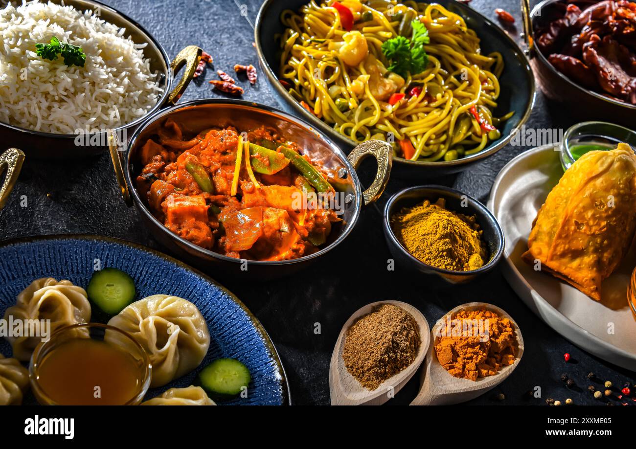 Composition with indian dishes: samosa, pakora, palak paneer, jalfrezi ...
