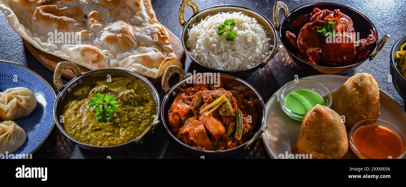 Composition with indian dishes: samosa, pakora, palak paneer, jalfrezi ...