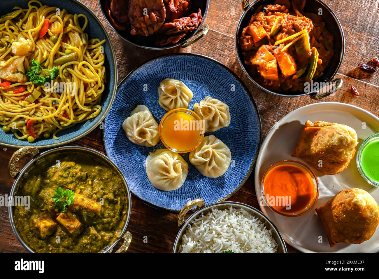 Composition with indian dishes: samosa, pakora, palak paneer, jalfrezi ...