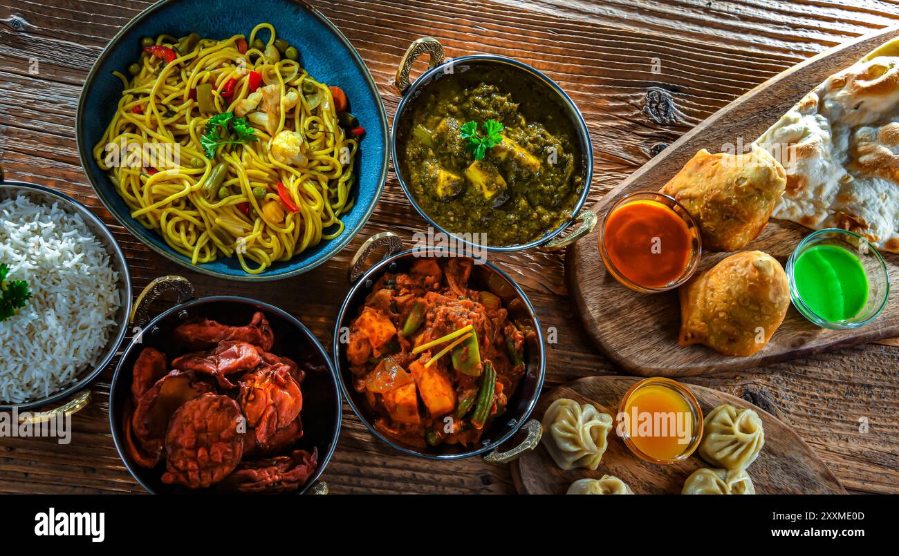 Composition with indian dishes: samosa, pakora, palak paneer, jalfrezi ...