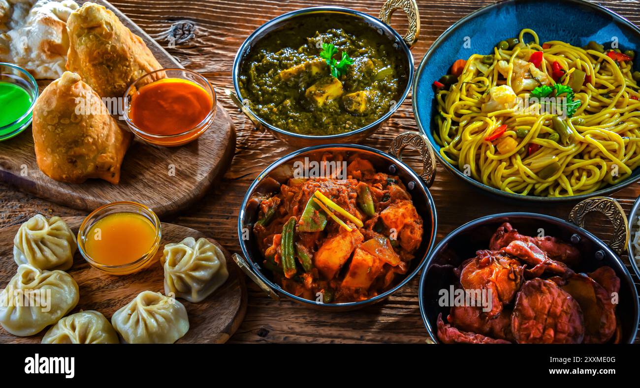 Composition with indian dishes: samosa, pakora, palak paneer, jalfrezi ...