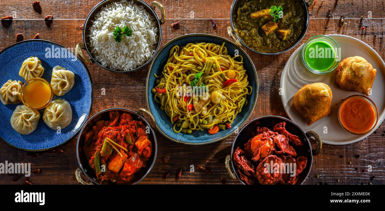 Composition with indian dishes: samosa, pakora, palak paneer, jalfrezi ...