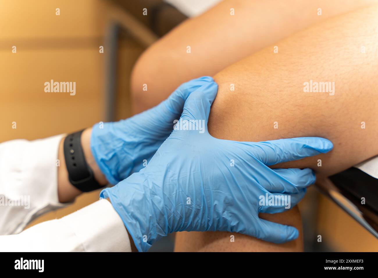 Comprehensive knee examination of a patient in a hospital clinical setting, focused on ...