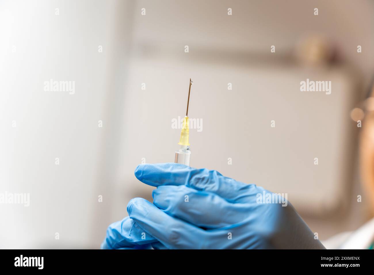 Doctor hand holding syringe hi-res stock photography and images - Alamy