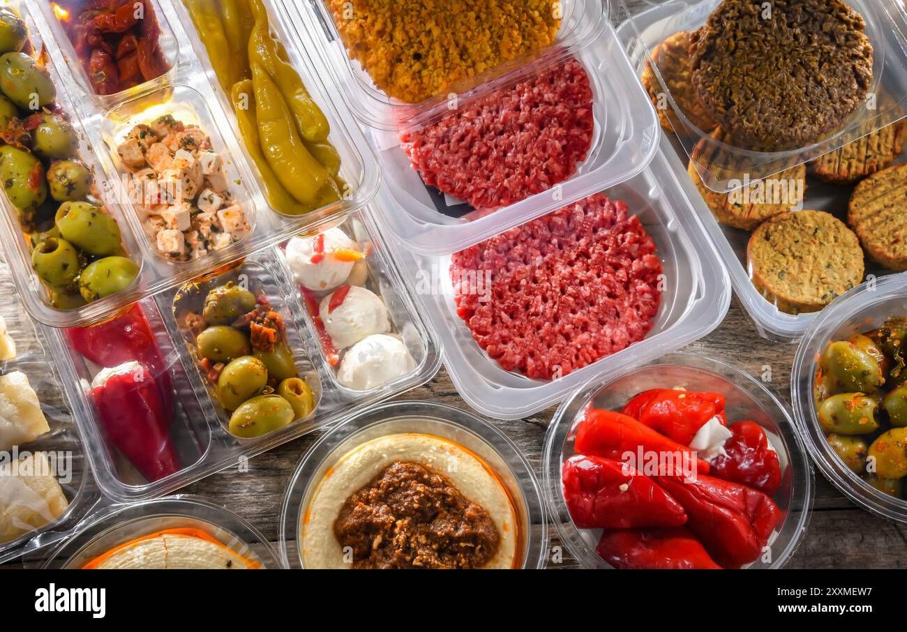 A display of variety of prepackaged food products in plastic boxes ...