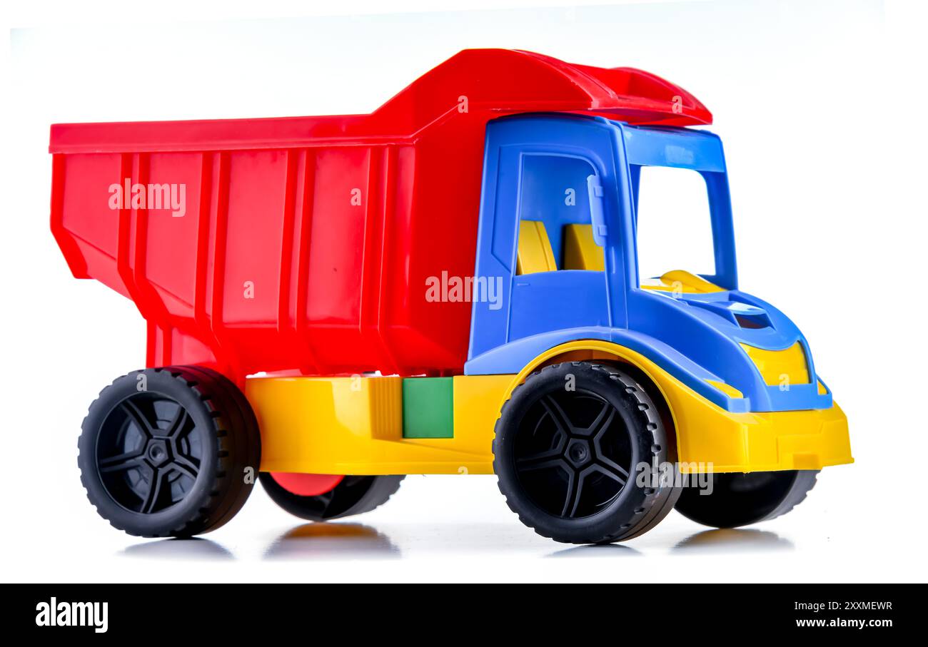 Colorful plastic dump truck isolated on white background Stock Photo ...