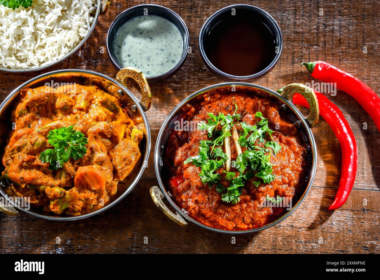 Hot madras paneer and vegetable masala with basmati rice served in ...