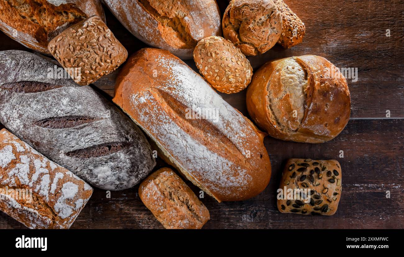 Assorted bakery products including loaves of bread and rolls Stock ...