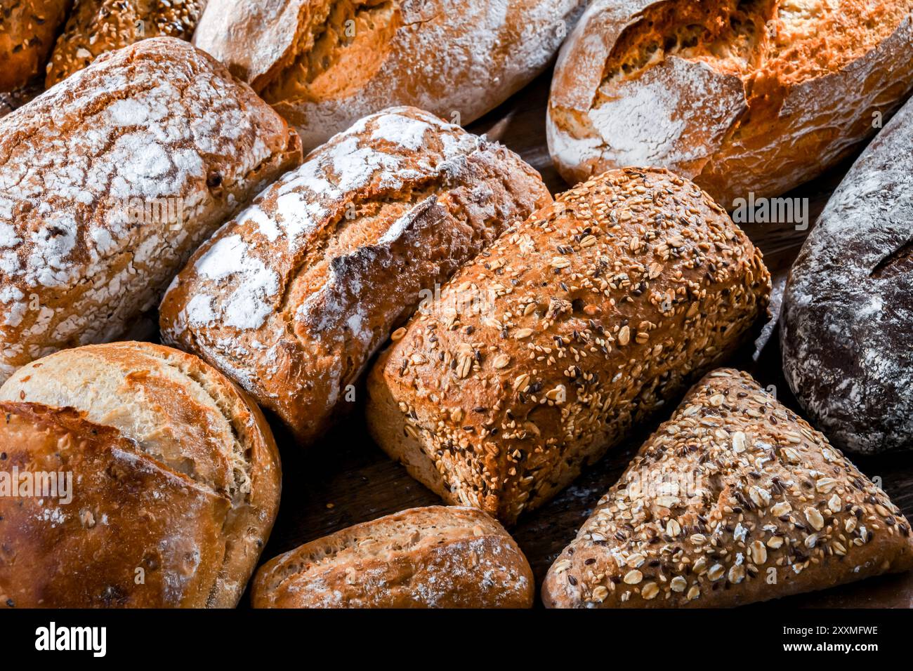 Assorted bakery products including loaves of bread and rolls Stock ...