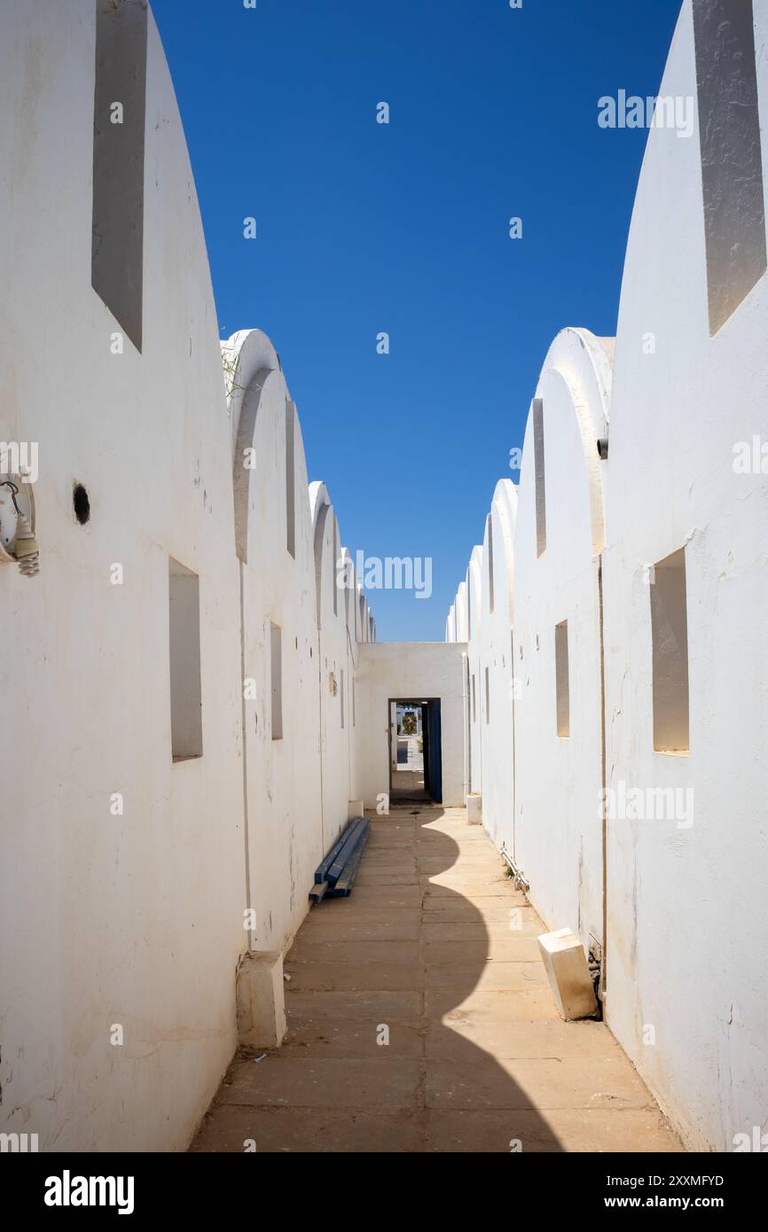 Traditional arabic style of the houses with white facade and archs ...