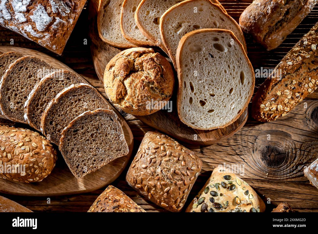 Assorted bakery products including loaves of bread and rolls Stock ...