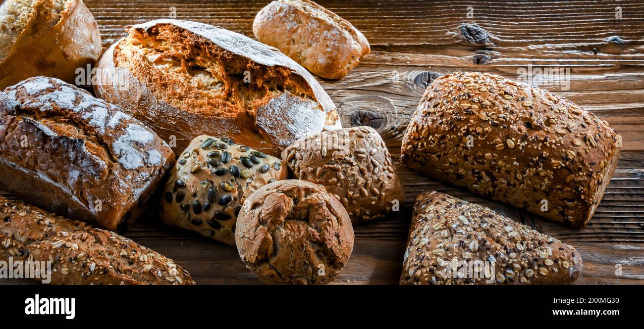 Assorted bakery products including loaves of bread and rolls Stock ...