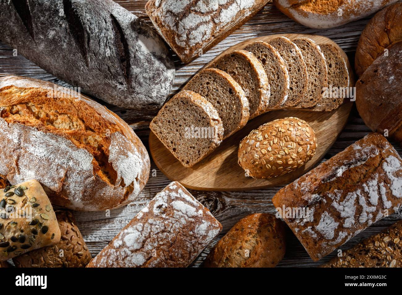 Assorted bakery products including loaves of bread and rolls Stock ...