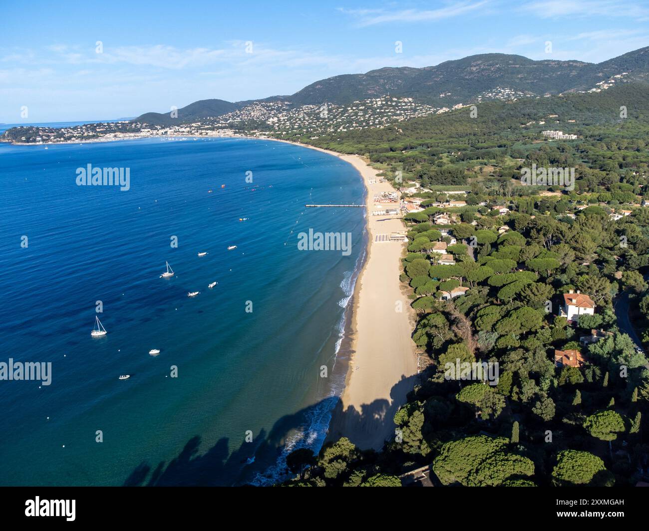 Aerial view on boats, crystal clear blue water of Plage du Debarquement ...