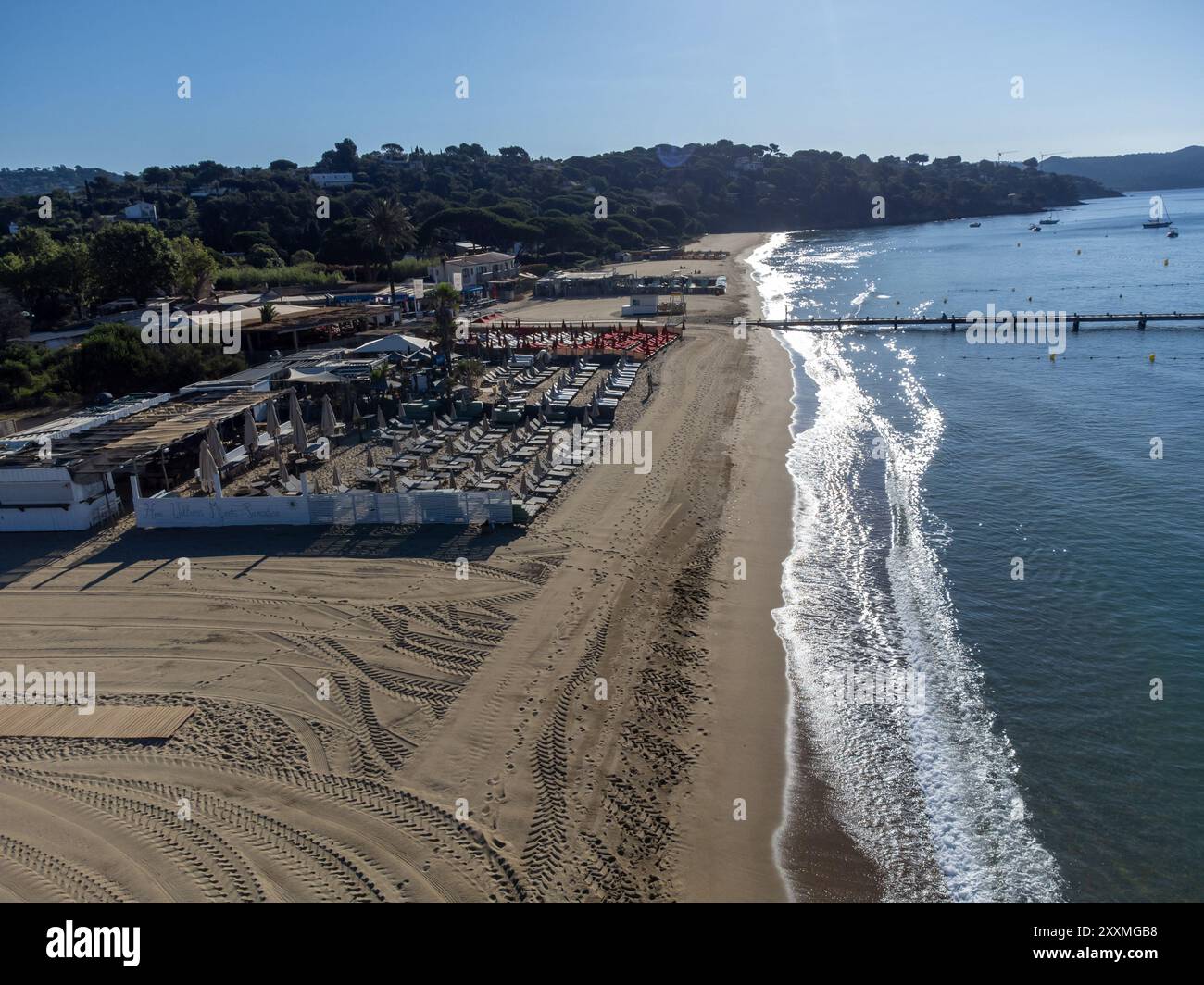 Aerial view on boats, crystal clear blue water of Plage du Debarquement ...