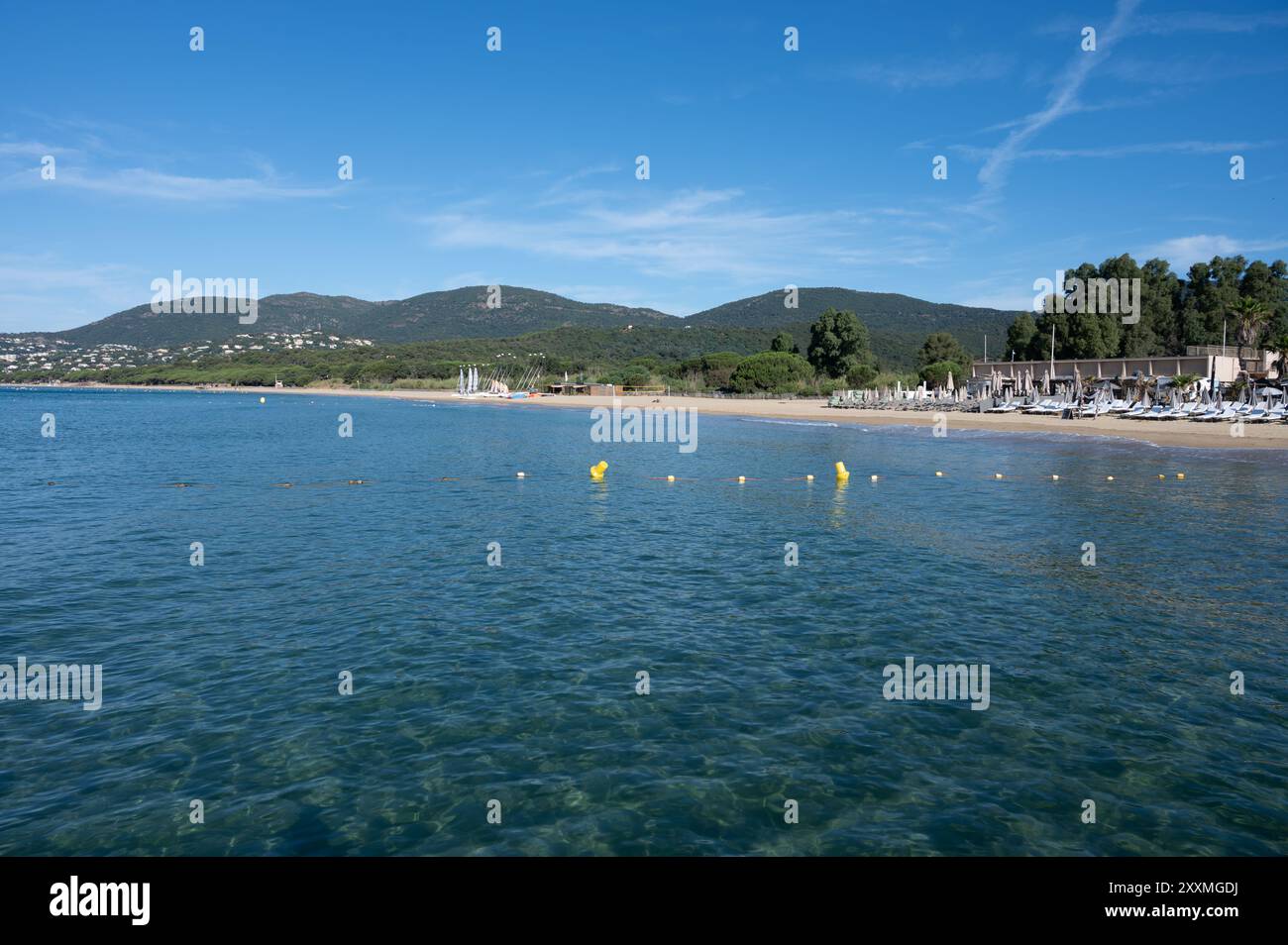 Morning view on crystal clear blue water and pier of Plage du ...