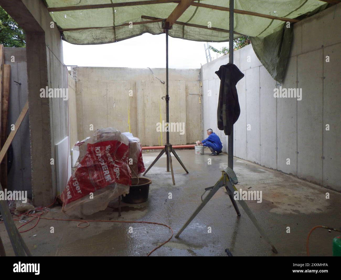construction worker at a building site, employee in construction ...