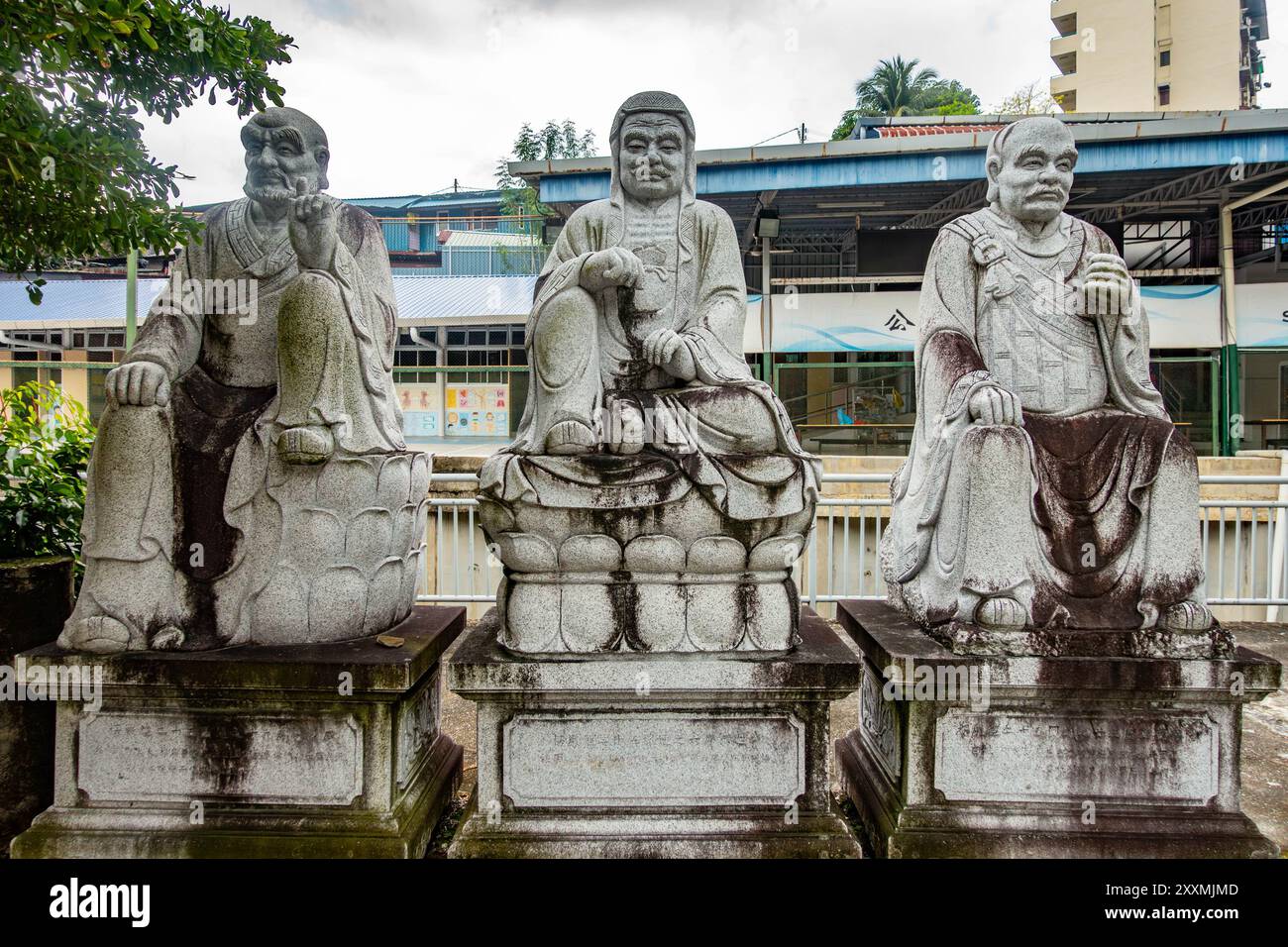 Buddhist figures sat on pedestals in the main visitors' car park at The ...