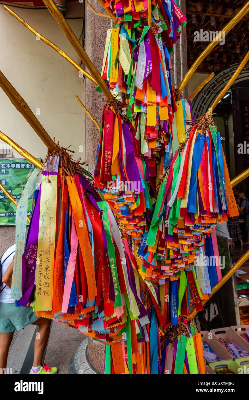 Coloured ribbons, each one representing a prayer on a prayer tree in ...