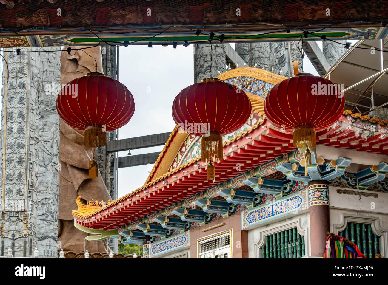 Bright red, traditional Chinese lanterns hang form the top of a ...
