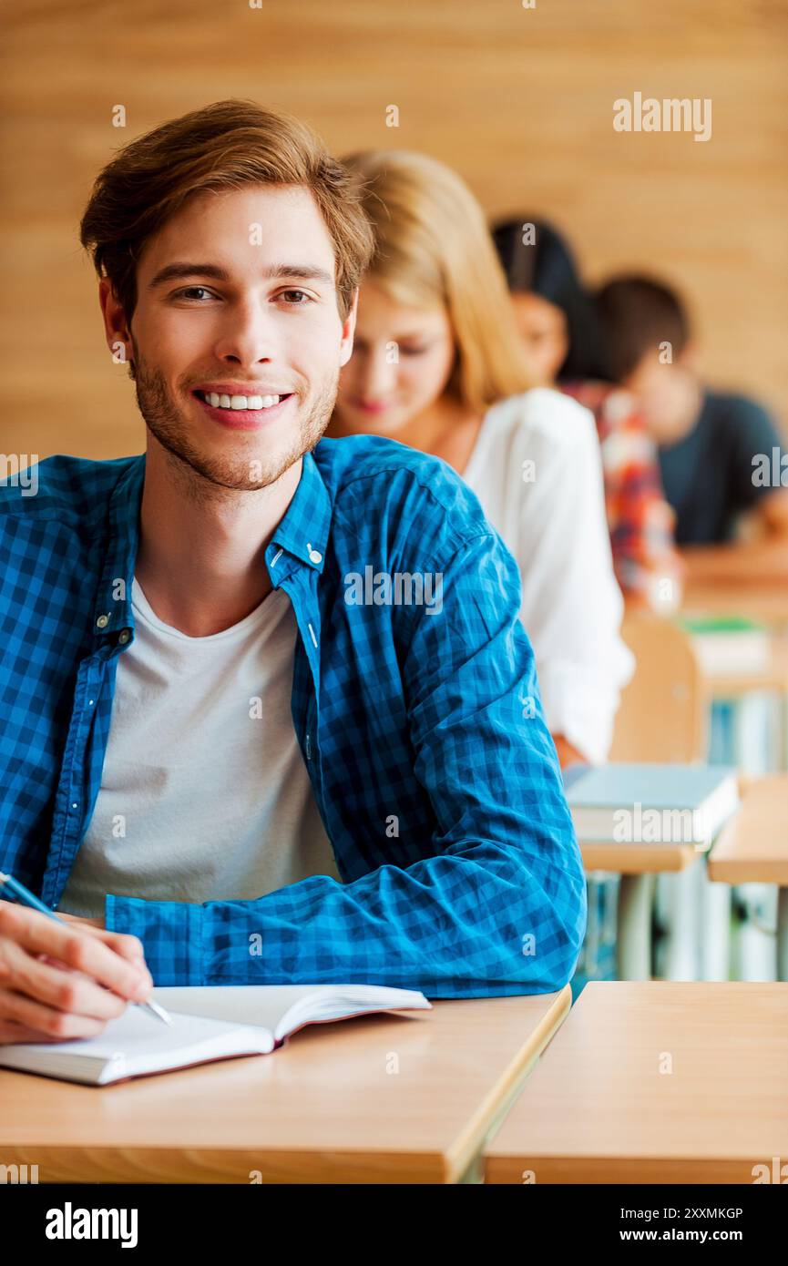 School student behind desk hi-res stock photography and images - Alamy