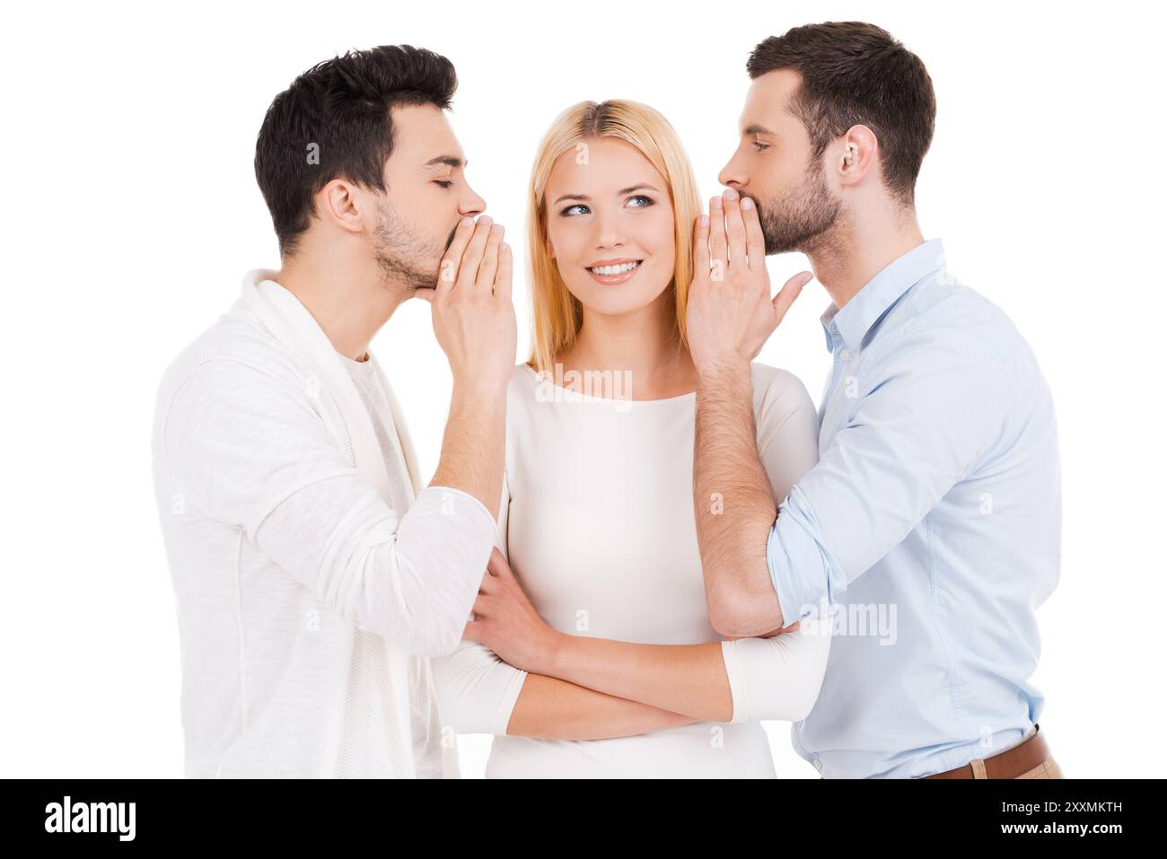 Young man telling gossips hi-res stock photography and images - Alamy
