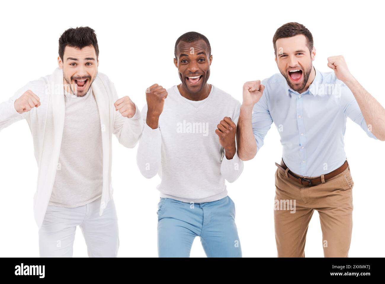 Men cheering. Three happy young men in smart casual wear expressing ...