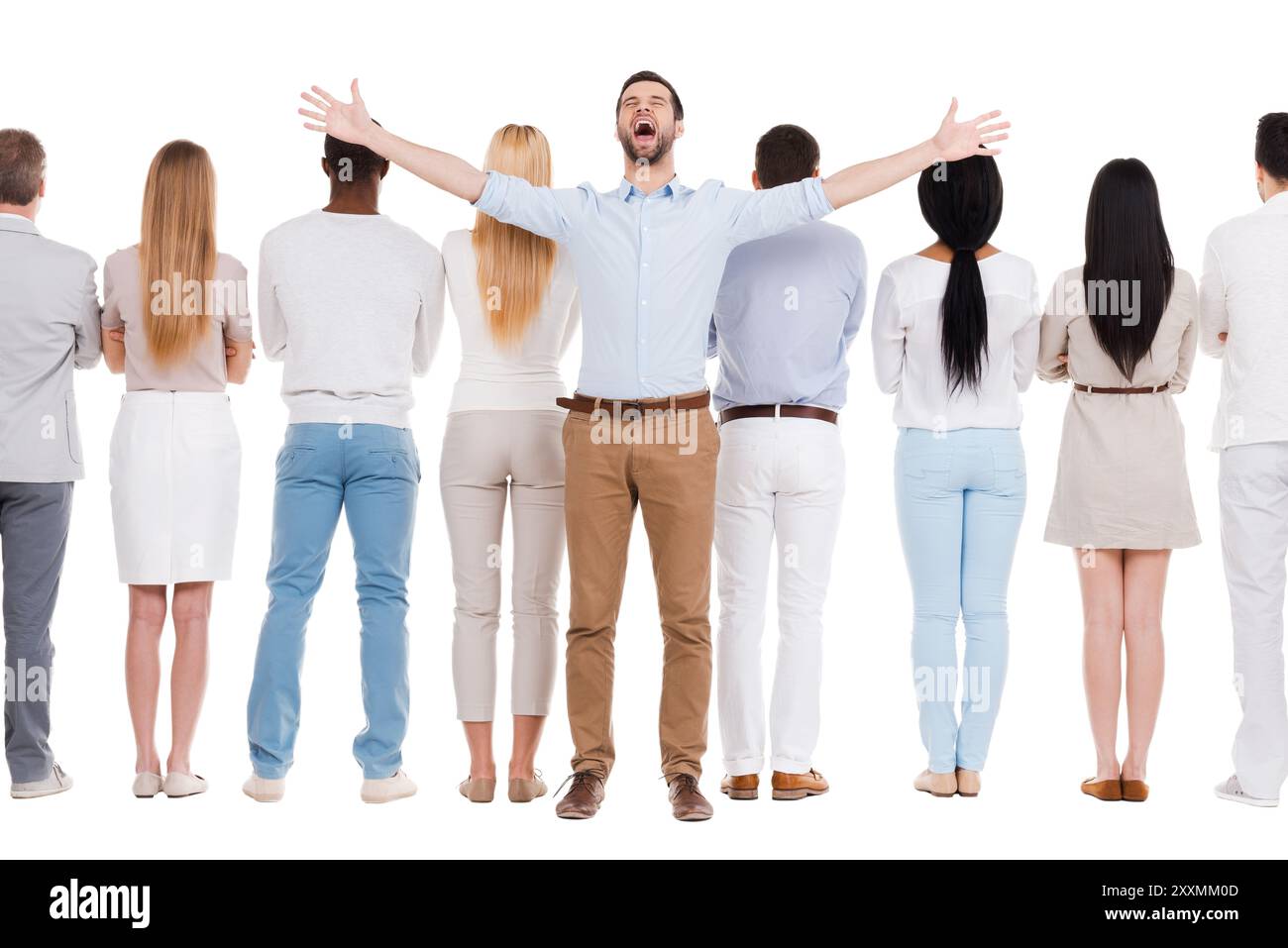 Business winner. Rear view of group of people standing in a row and ...