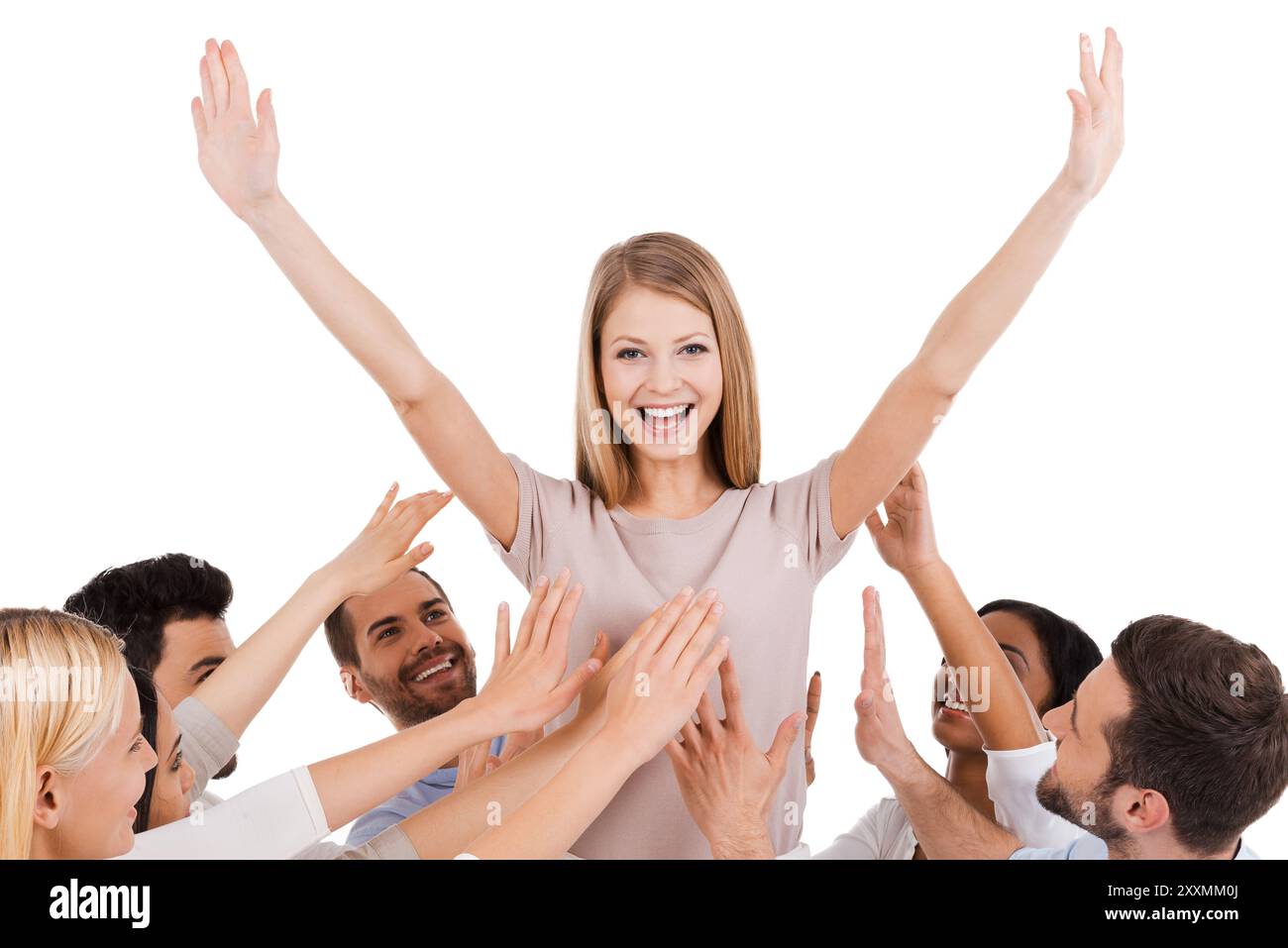 She is a real leader. Happy young woman standing against white ...