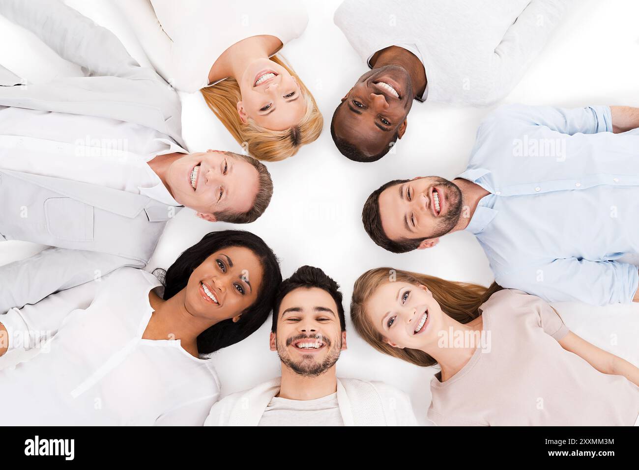 Together we are stronger. Top view of cheerful group of multi-ethnic ...