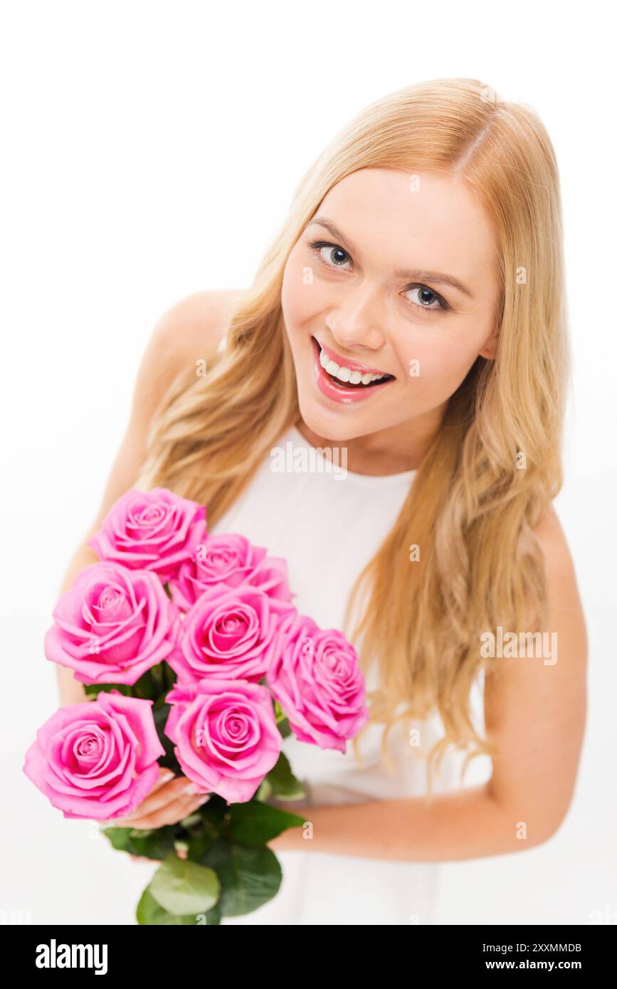 Beauty with roses. Top view of beautiful young blond hair woman holding ...