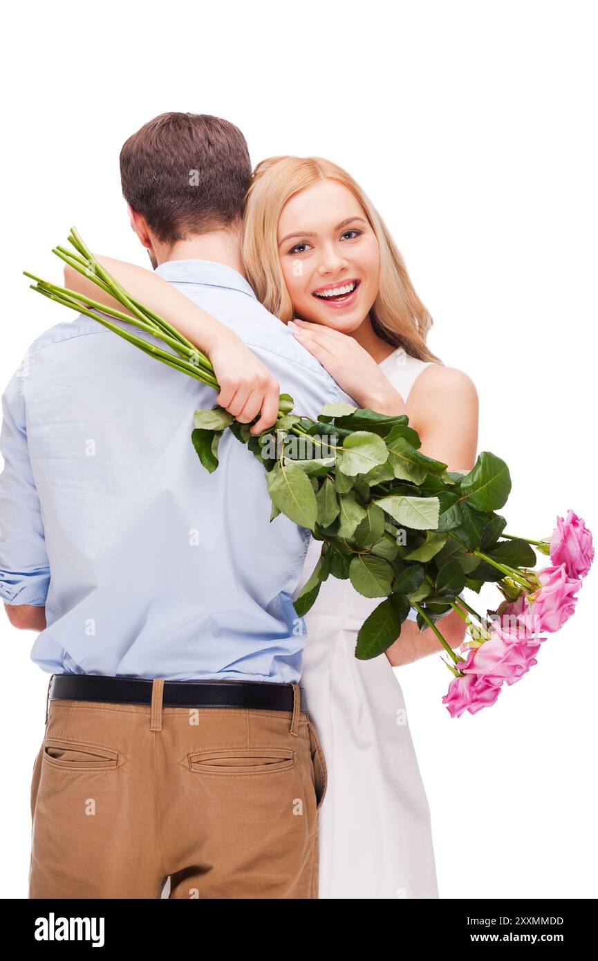 Celebrating love. Beautiful young loving couple hugging while woman ...