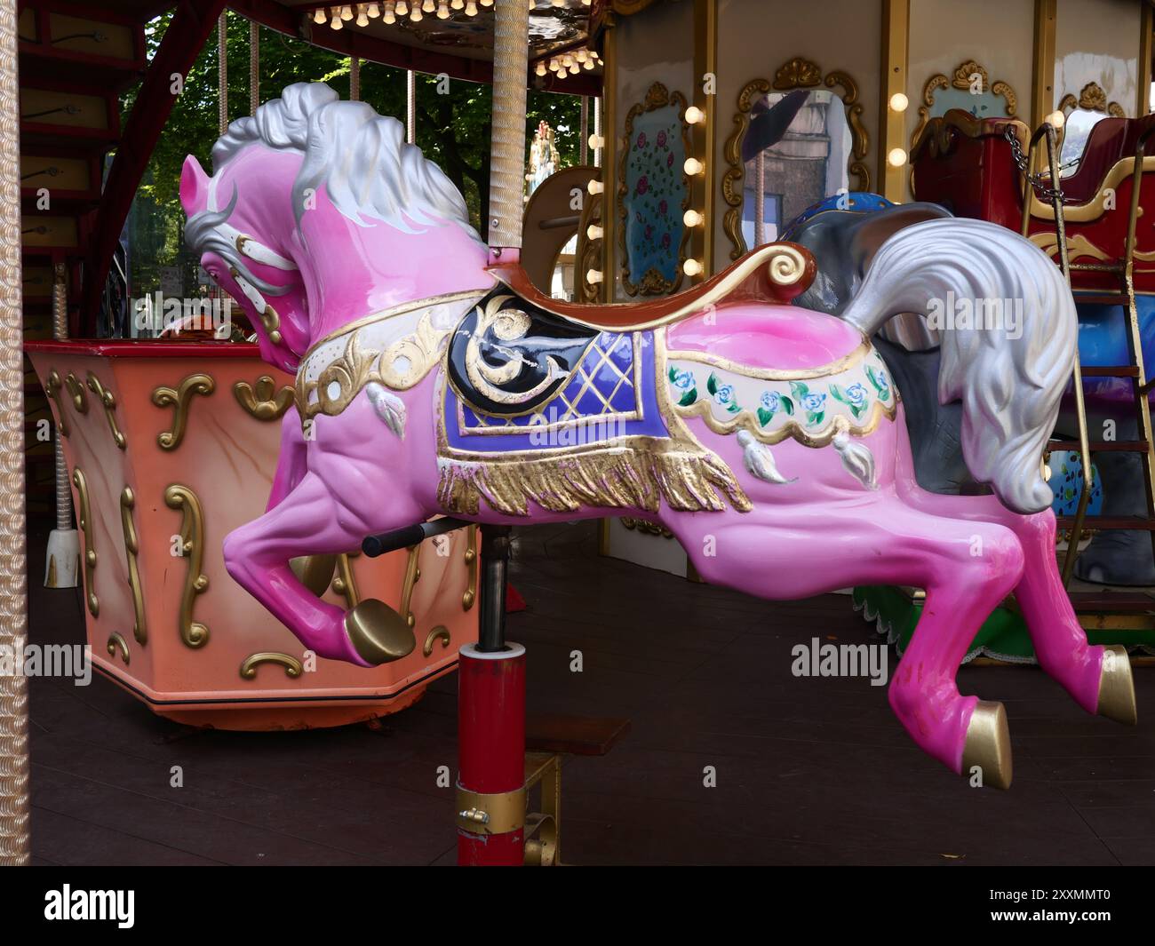 Prancing Pony Pink carousel horse at a fun fair fairground Stock Photo ...
