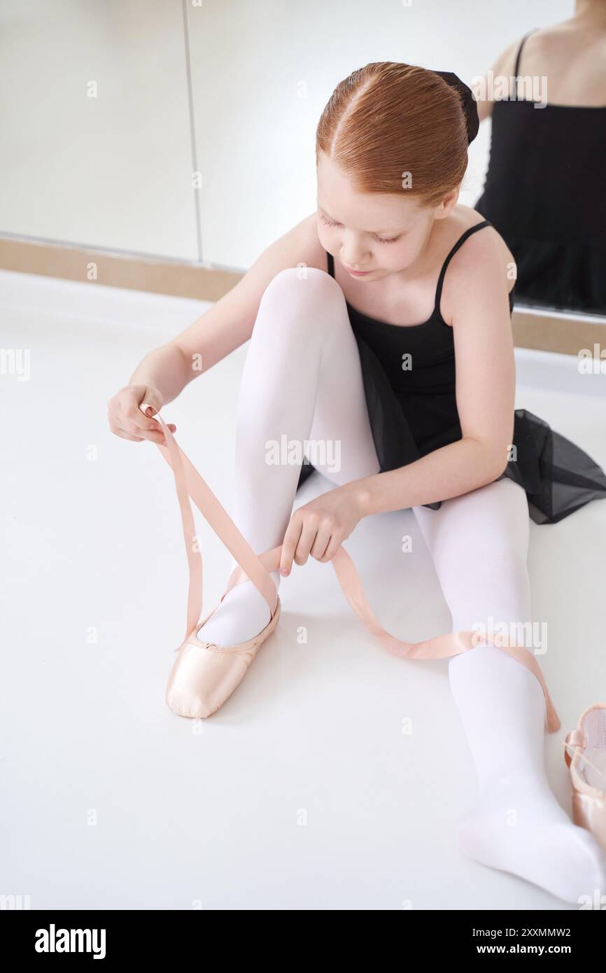 Young ballet girl at studio lesson. Portrait. Training performance ...